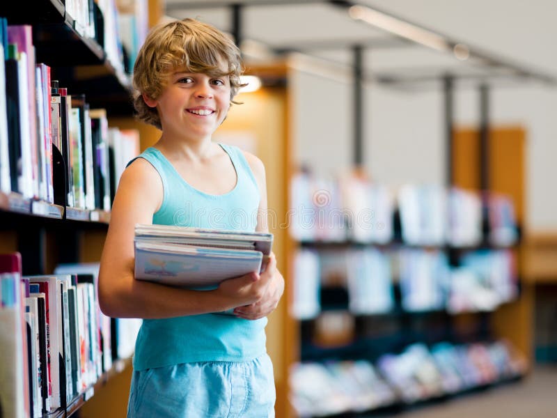 Boy in library stock photo. Image of project, select - 56147476