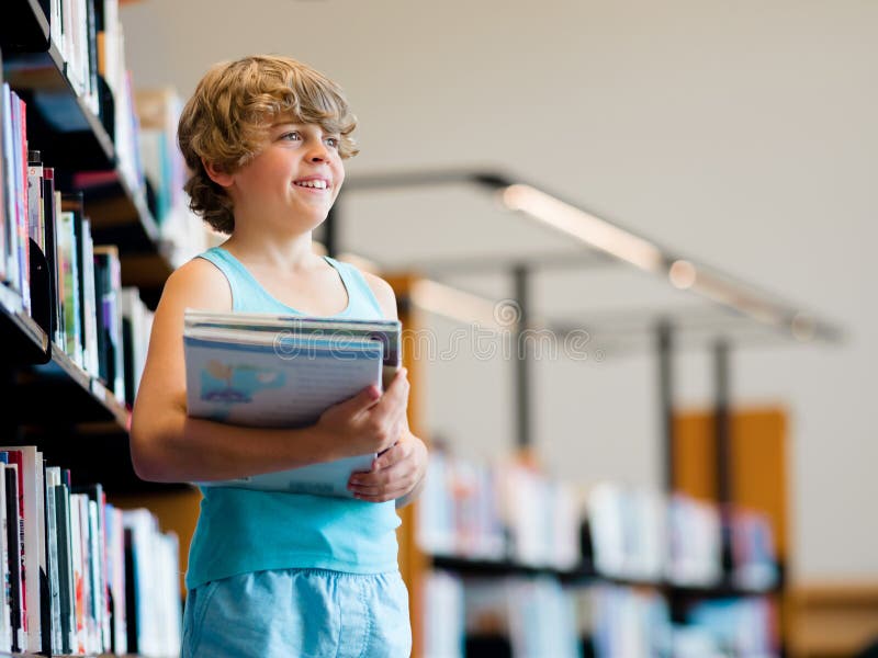 Boy in library stock image. Image of read, library, male - 56207123