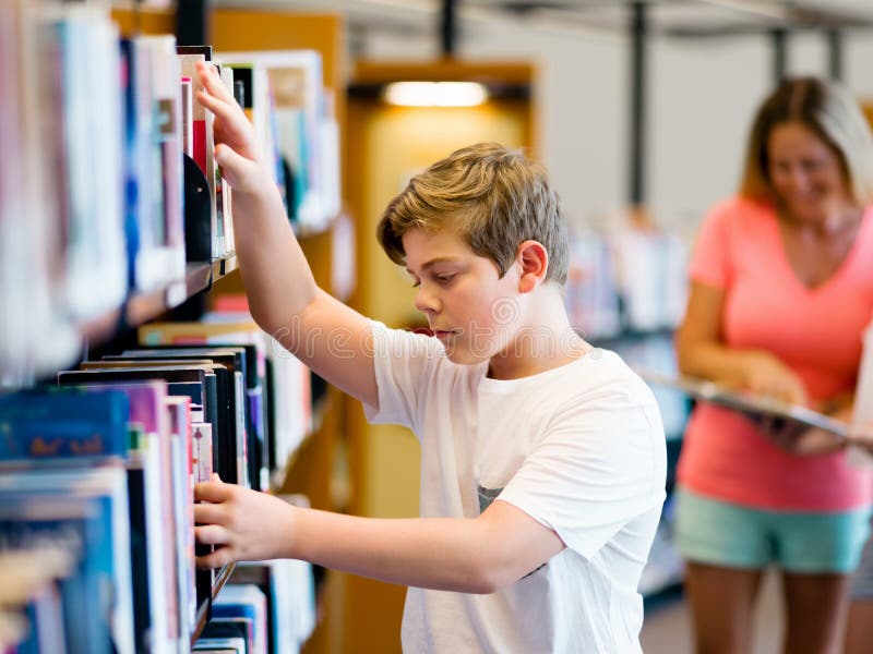 Boy in library stock image. Image of bookshelf, portrait - 60921583