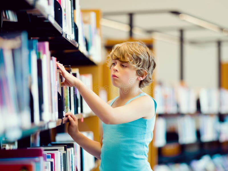 Boy in library stock photo. Image of smile, people, education - 93106762