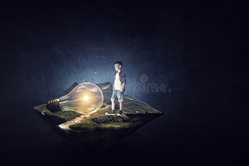 Boy with a light bulb stock photo. Image of innovation - 184164166
