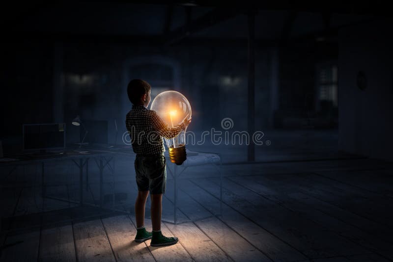 Boy with a light bulb stock image. Image of happiness - 187213277