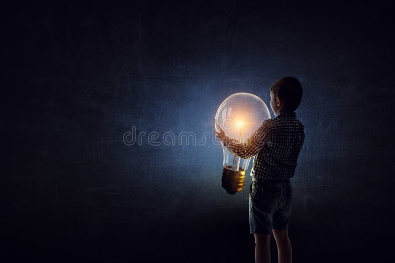 Boy with a light bulb stock photo. Image of color, book - 191357492
