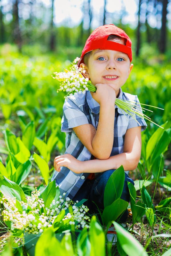 Boy with Lilies of the Valley Stock Image - Image of preschooler ...