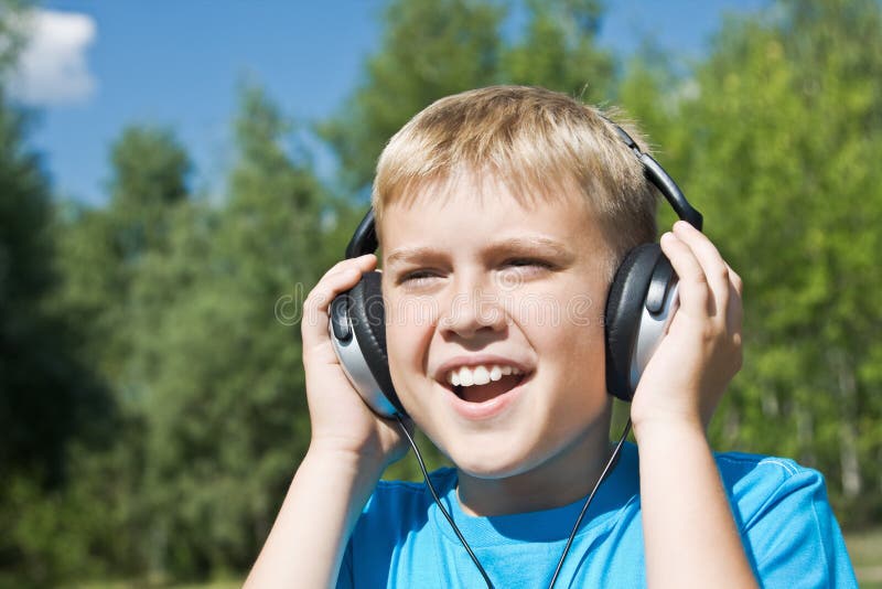 Boy listening to music stock photo. Image of gray, childhood - 4299242