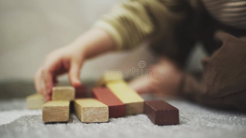 Boy and Little Girl Playing with Cubes and Blocks on the Floor at Home ...