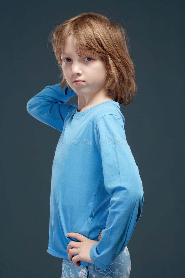 Portrait of a Boy with Long Blond Hair in Blue Top. Stock Photo - Image ...