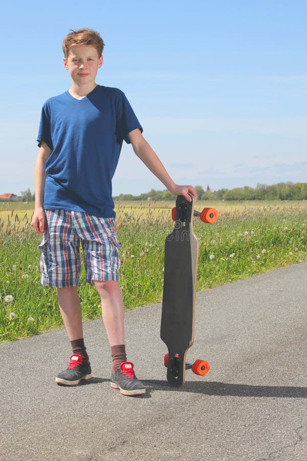 Boy with longboard stock image. Image of skate, skater - 54543579