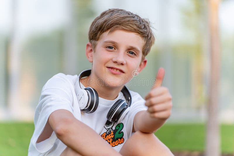 Boy Looking at Camera and Smiling while Showing Thumb Up. Stock Image ...