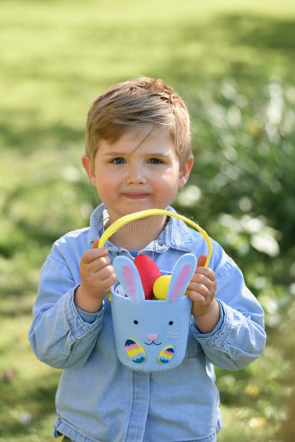 A Boy Looking for Eggs in a Bag for Easter Stock Image - Image of ...
