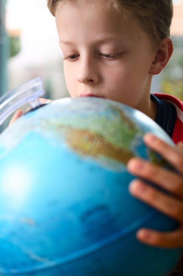 Boy looking at globe stock image. Image of globe, finding - 36202991