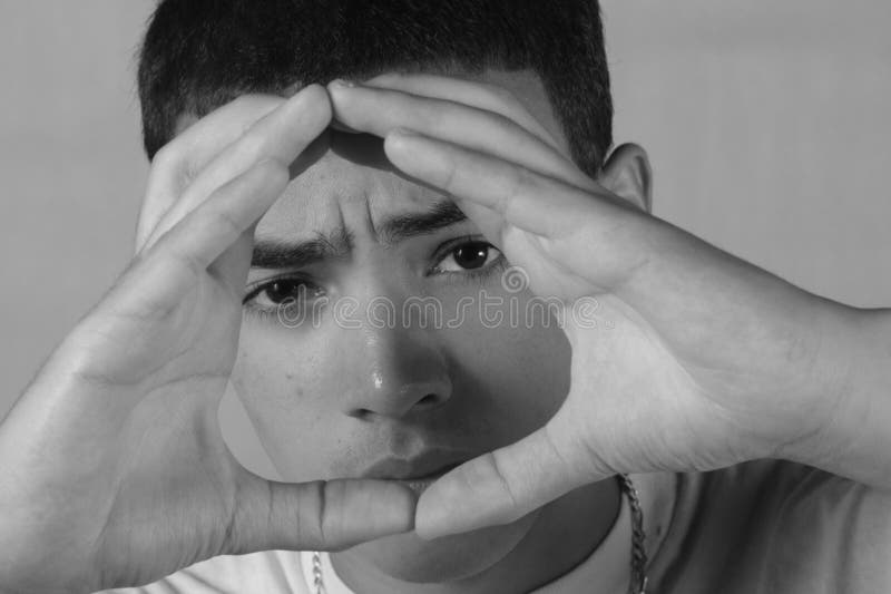 Boy looking through hands stock image. Image of hand, round - 6382047