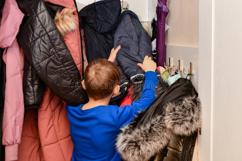 The Boy is Looking for His Things and Takes Them Out of the Home ...