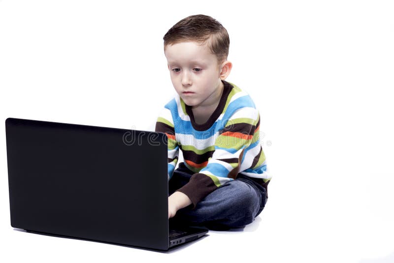 Boy playing with a laptop stock image. Image of childhood - 30044823
