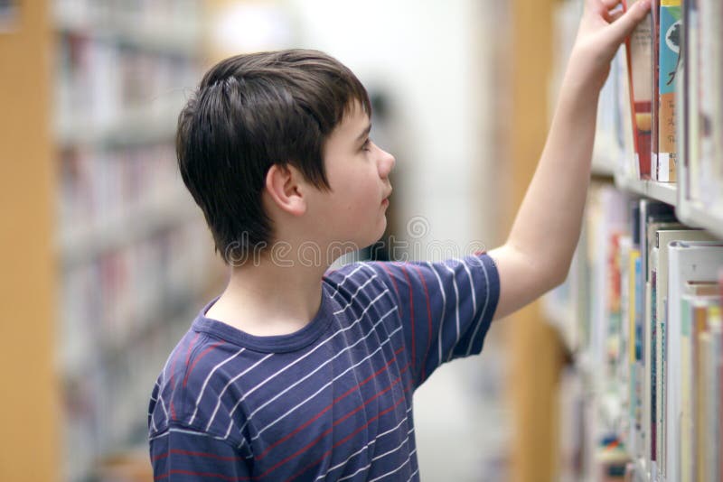 Boy Looking for Library Book Stock Photo - Image of communication ...