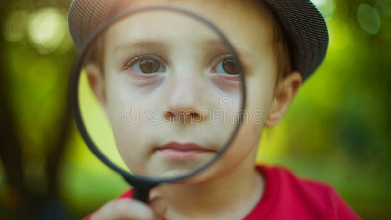 Boy Looking through a Magnifier Stock Footage - Video of eyesight ...
