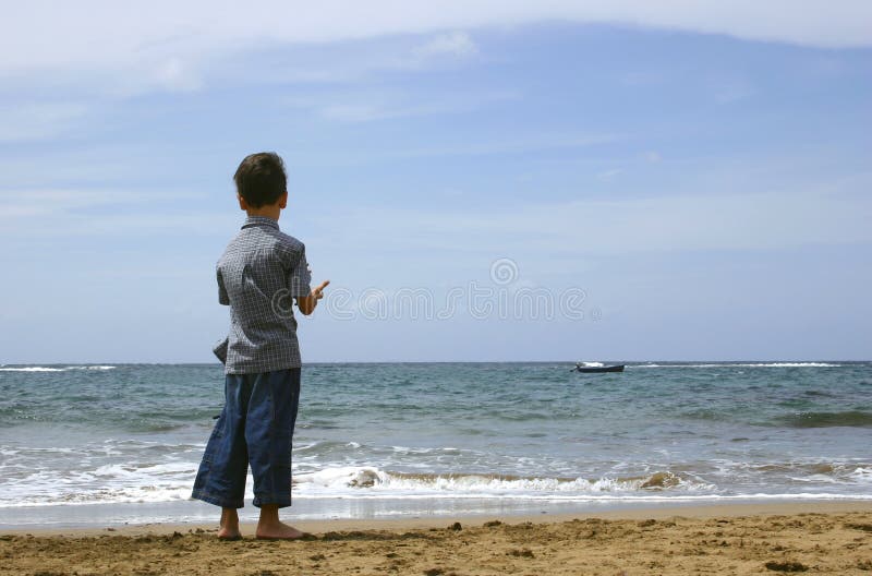 Boy Looking at the Ocean stock image. Image of vista, view - 129151