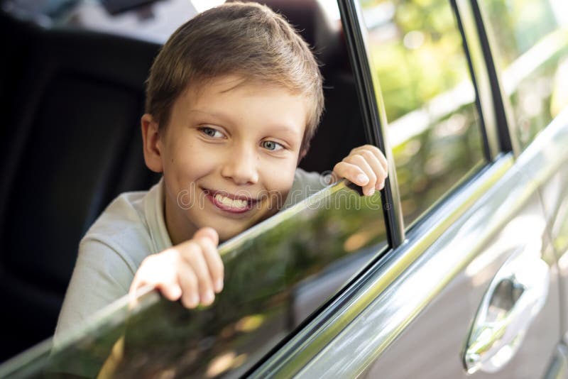 Boy Looking Out the Car Window Stock Photo - Image of thinking ...