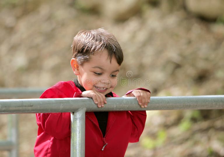Boy Looking Over a Railing at a Bridge Stock Image - Image of river ...