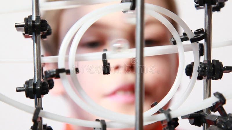 Boy Looks at Marbles Go through 360 Degree Loop, Stock Footage - Video ...