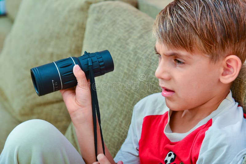 The Boy Looks in a Monocle. Stock Image - Image of childish ...