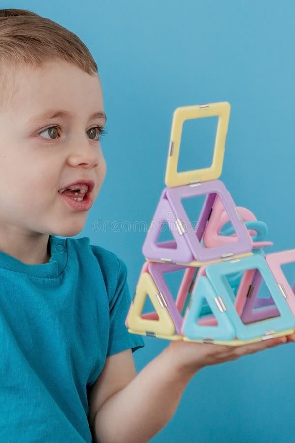 Boy Looks through the Shape in the Color Constructor with the ...