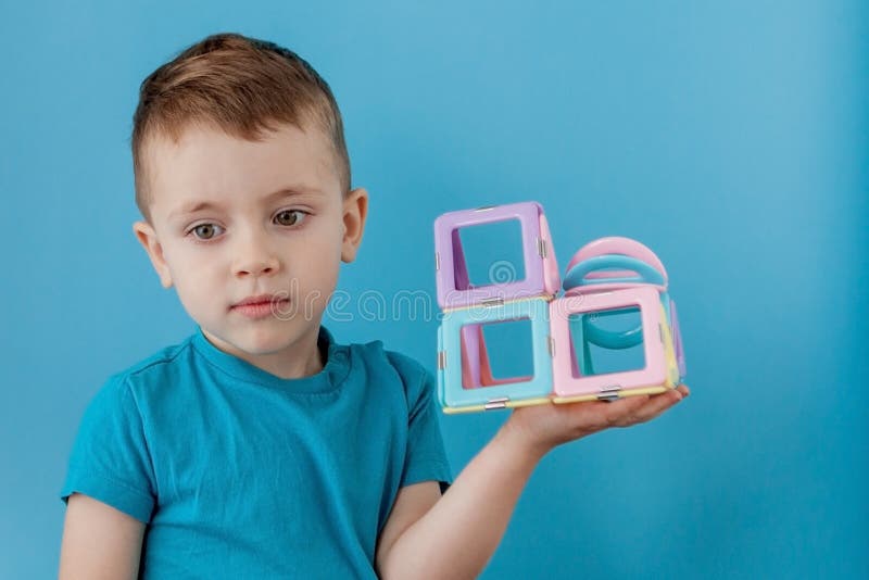 Boy Looks through the Shape in the Color Constructor with the ...