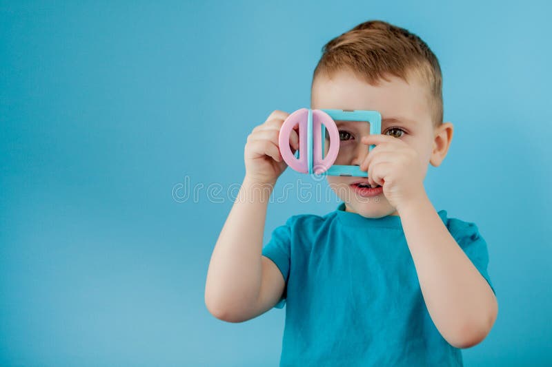 Boy Looks through the Shape in the Color Constructor with the ...
