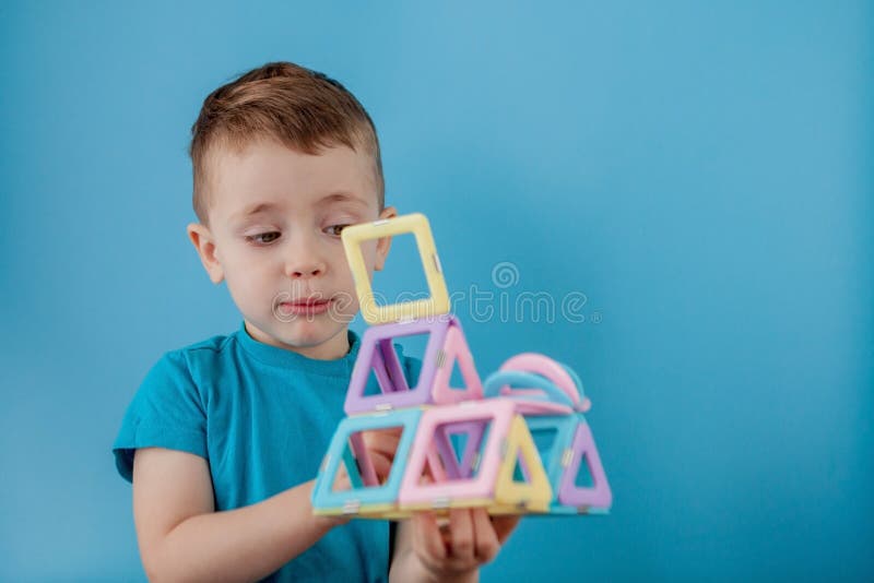 Boy Looks through the Shape in the Color Constructor with the ...