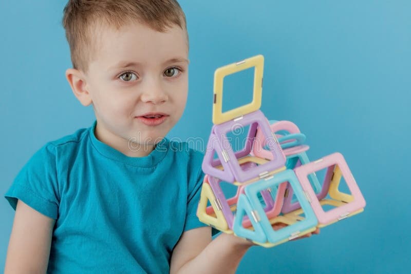 Boy Looks through the Shape in the Color Constructor with the ...