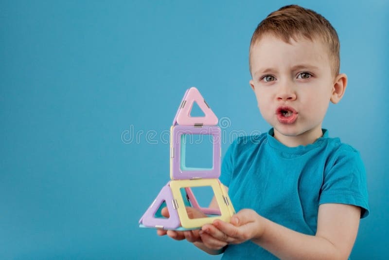 Boy Looks through the Shape in the Color Constructor with the ...