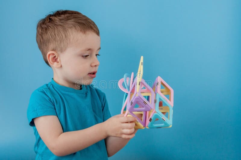 Boy Looks through the Shape in the Color Constructor with the ...