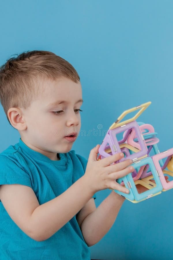 Boy Looks through the Shape in the Color Constructor with the ...