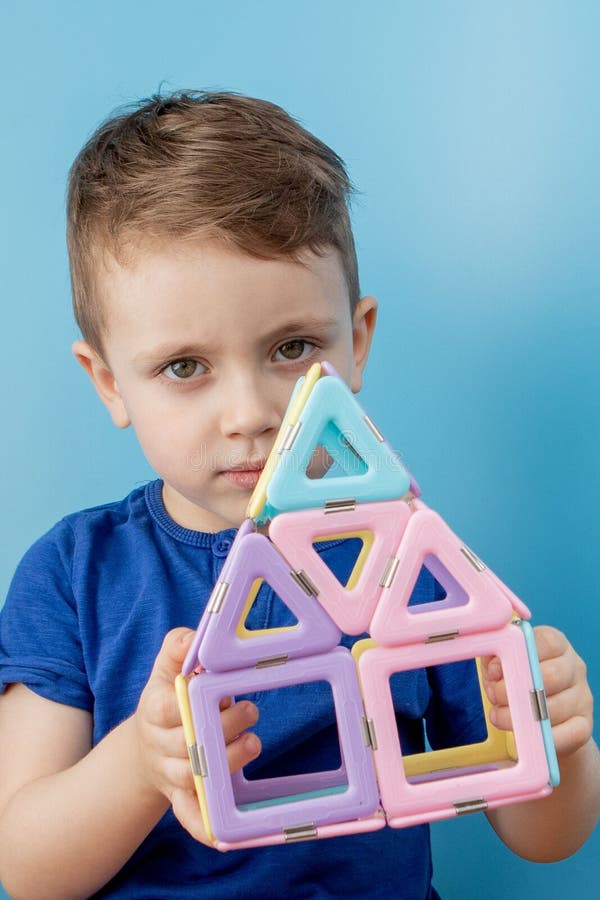 Boy Looks through the Shape in the Color Constructor with the ...