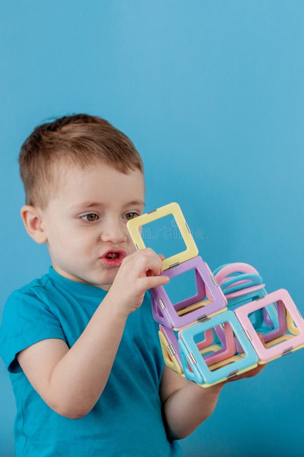 Boy Looks through the Shape in the Color Constructor with the ...