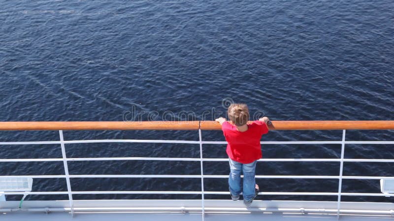Boy Looks at Water Standing on Ship Deck in Stock Video - Video of blue ...