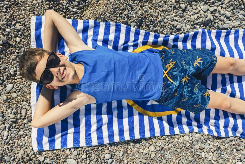Boy Lying on Beach and Having Fun Stock Photo - Image of little ...
