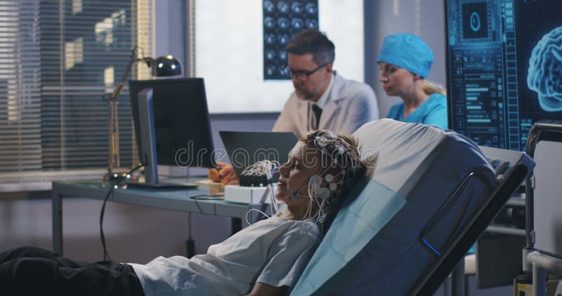 Boy Lying in Bed during EEG Examination Stock Video - Video of ...