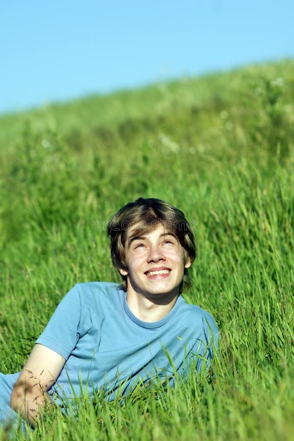 Boy Lying on the Fresh Green Grass Stock Photo - Image of outdoors ...