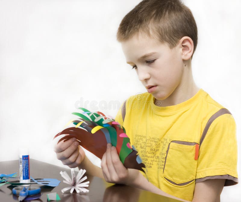 The boy makes crafts. stock photo. Image of teenager - 13449226