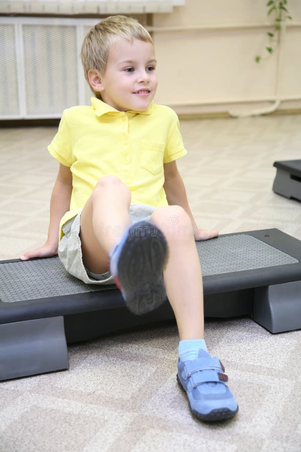 Boy makes exercise 2 stock image. Image of play, gymnasium - 3357431