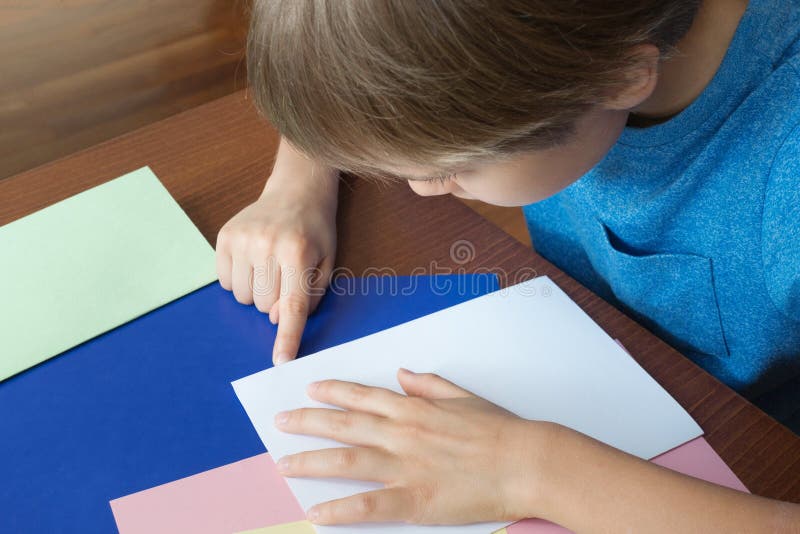 Boy Makes Greeting Card Using Colored Paper Stock Photo - Image of ...