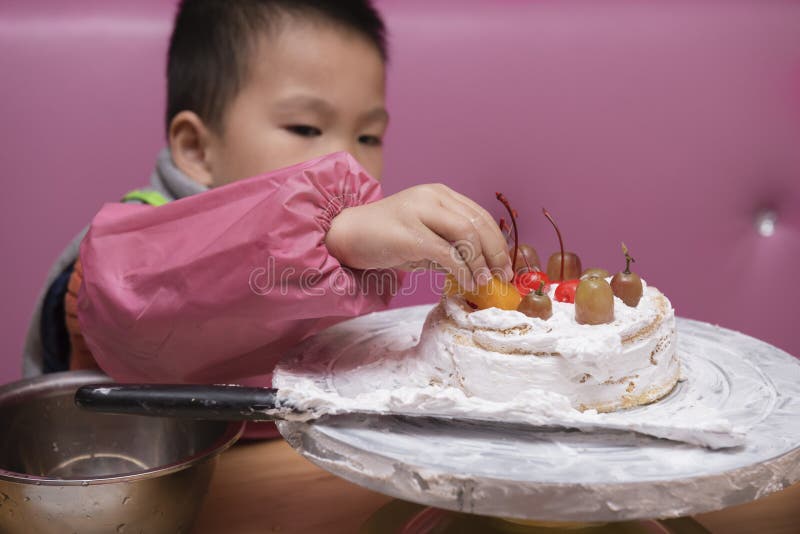 Boy making cake stock image. Image of life, cook, finger - 47591377