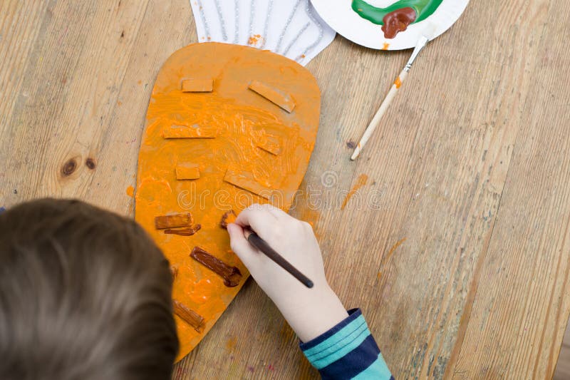 Boy Making a Carrot from Cardboard Stock Image - Image of carrot, hobby ...