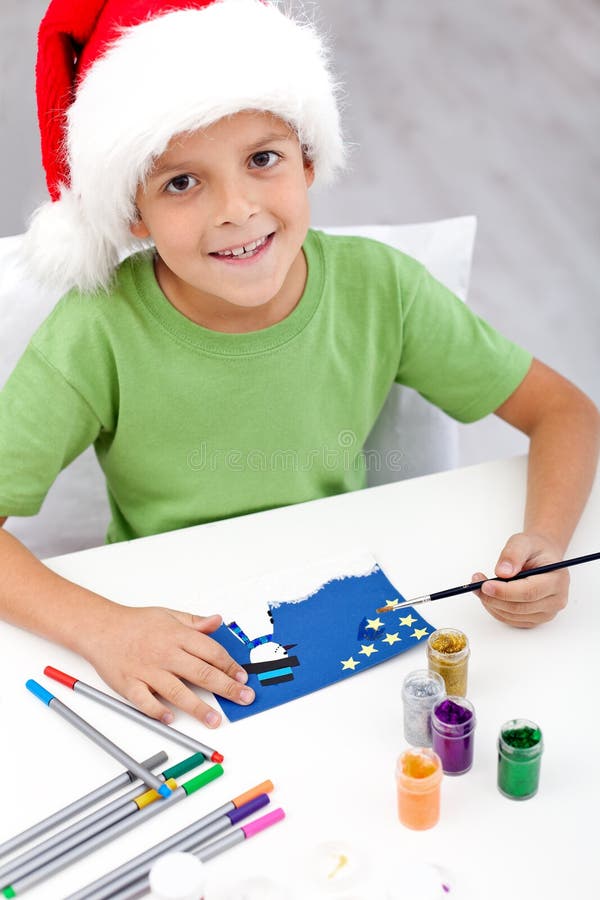 Boy making christmas card stock photo. Image of holding - 27874198