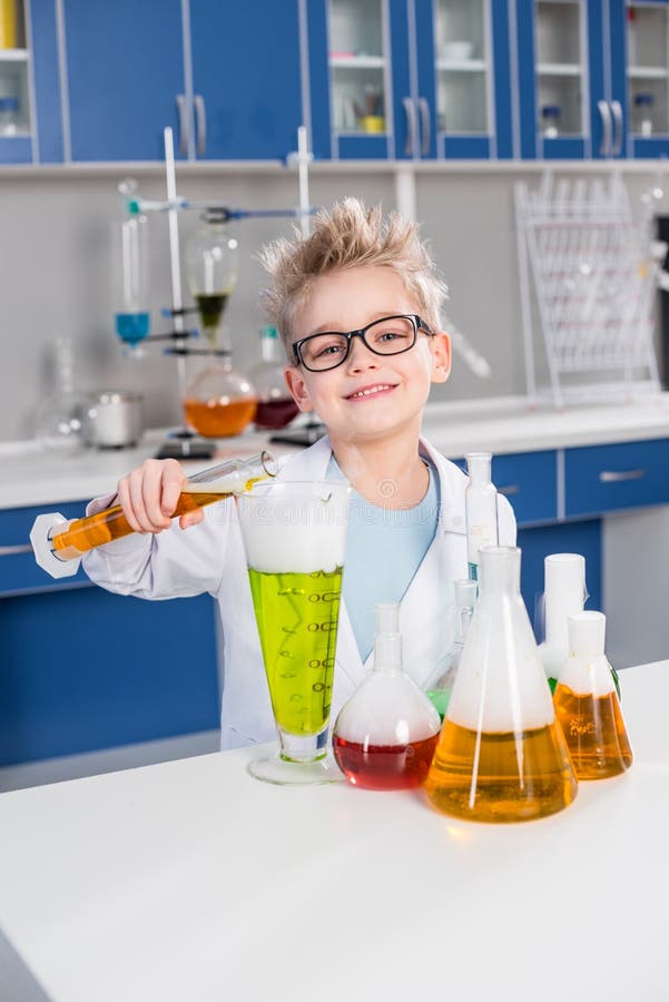 Boy making experiment stock image. Image of scientist - 90722273