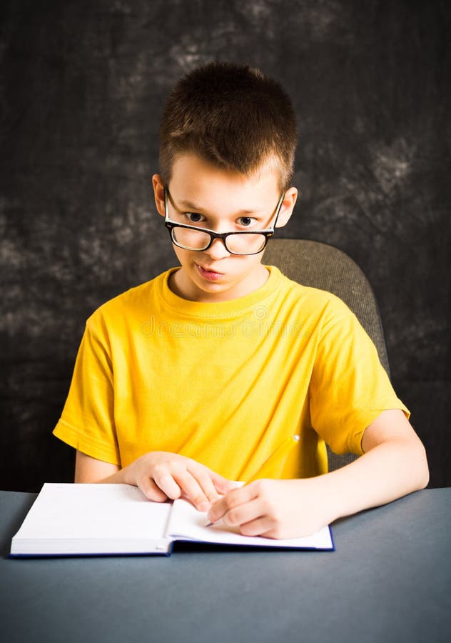 Boy Making Faces while Studying Stock Photo - Image of child, nerd ...