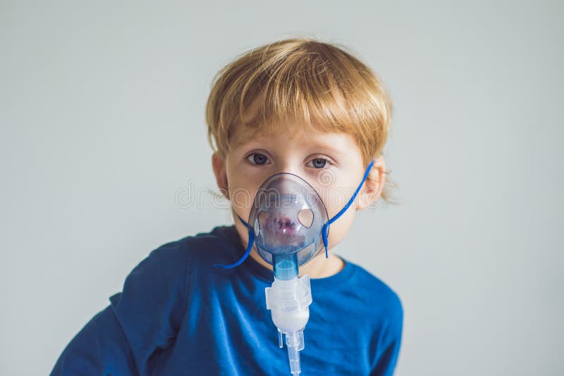 Two Year Old Boy Making Inhalation with Nebulizer at Home Stock Image ...
