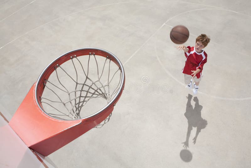 Boy making jump shot stock image. Image of jump, health - 9718855