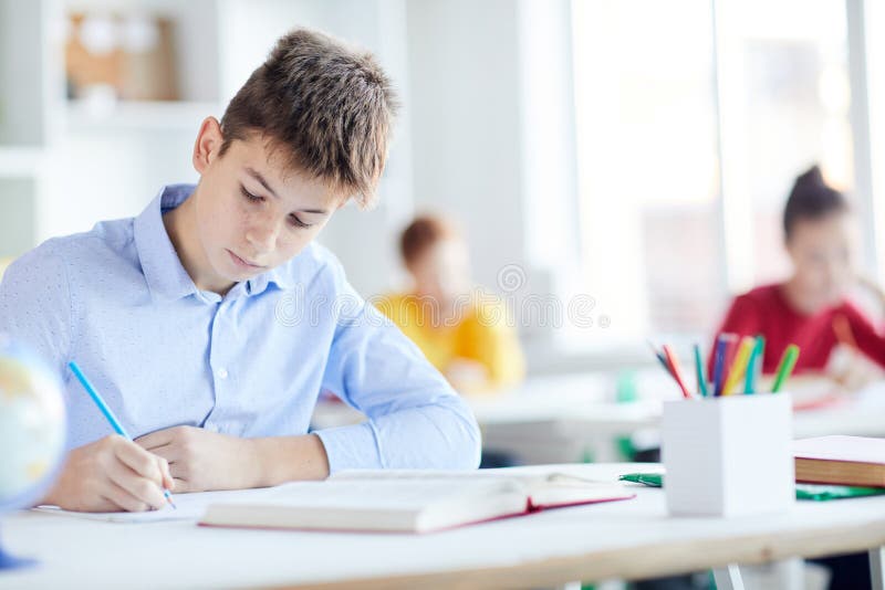 Boy making notes stock image. Image of education, inspiration - 136540797